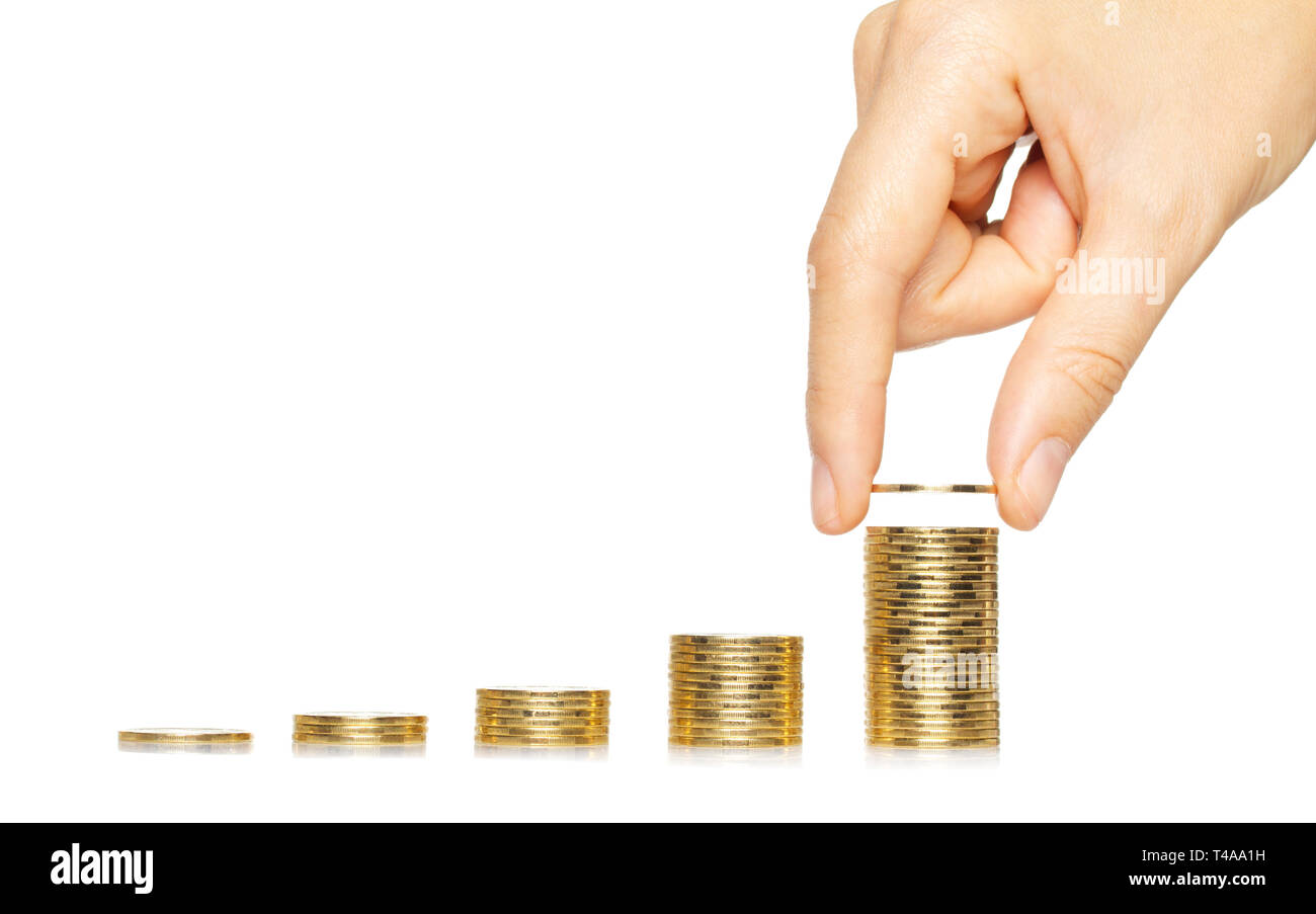 adding a coin to stack isolated on white Stock Photo - Alamy