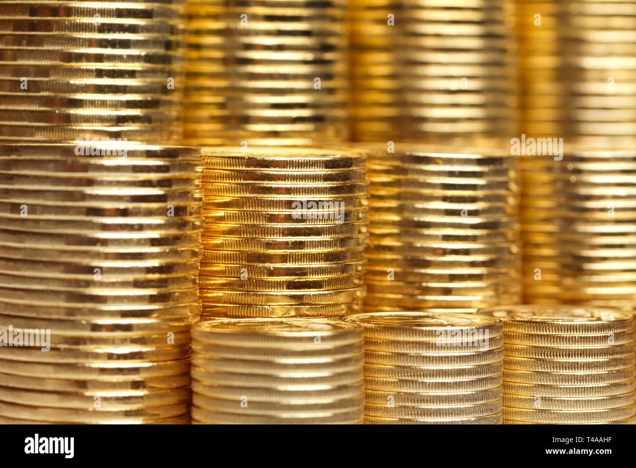 shiny new coins stack background Stock Photo - Alamy