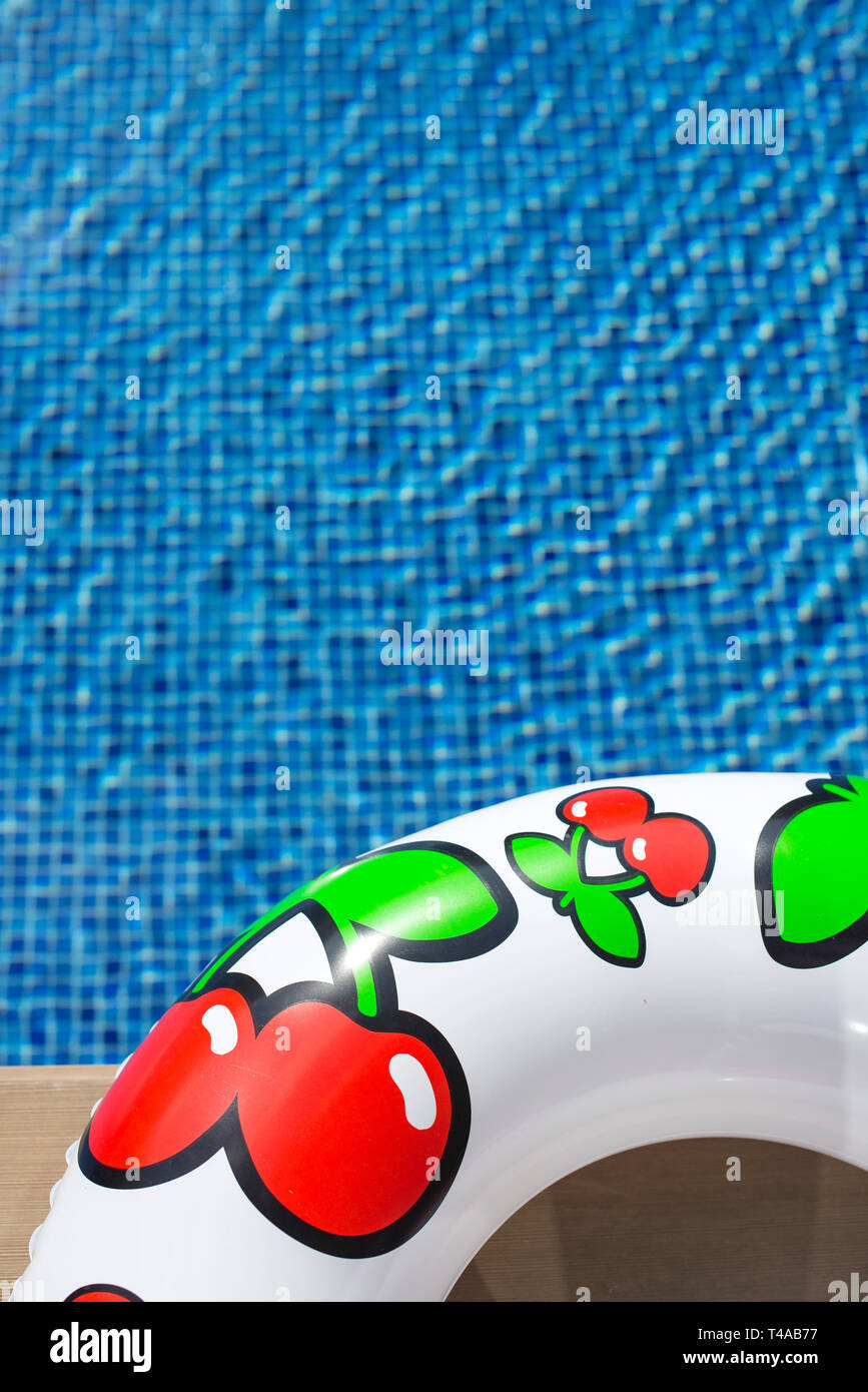 Inflatable rubber ring with Pacha cherry logo by swimming pool Stock ...