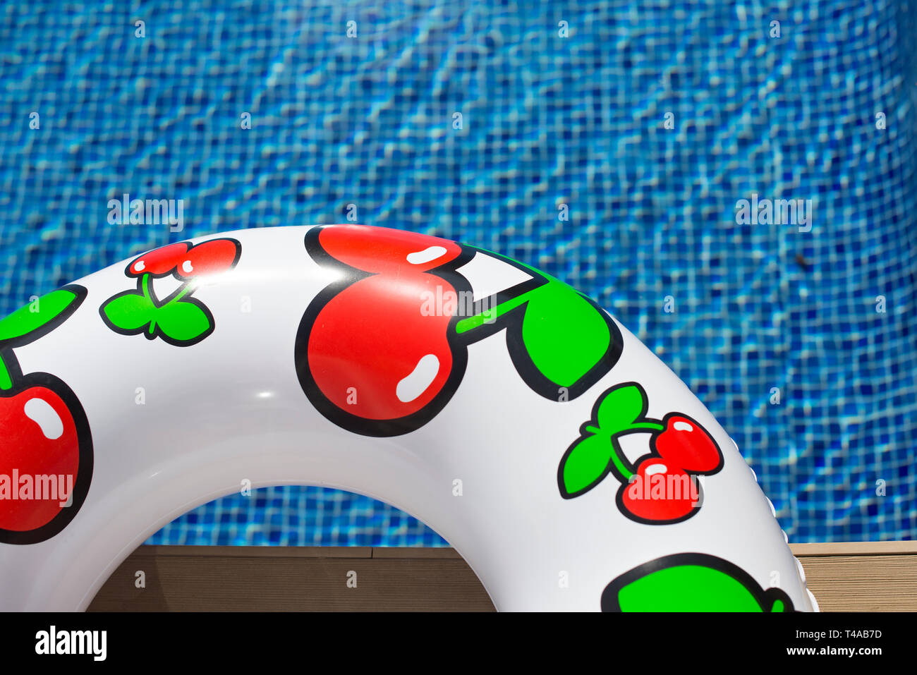 Inflatable rubber ring with Pacha cherry logo by swimming pool Stock ...