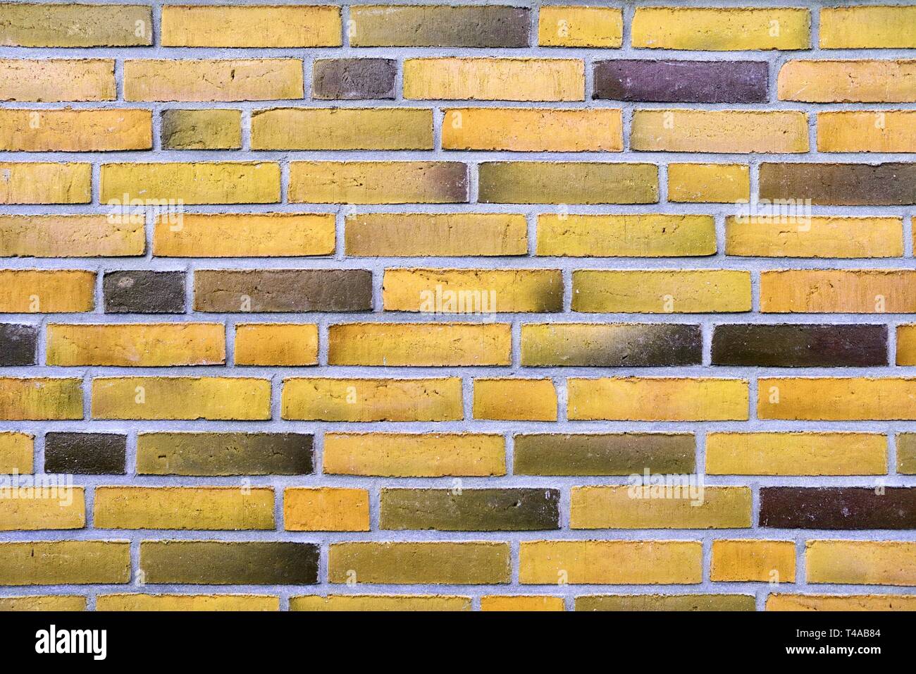 Weathered and aged yellow brick walls with cracks in high resolution ...