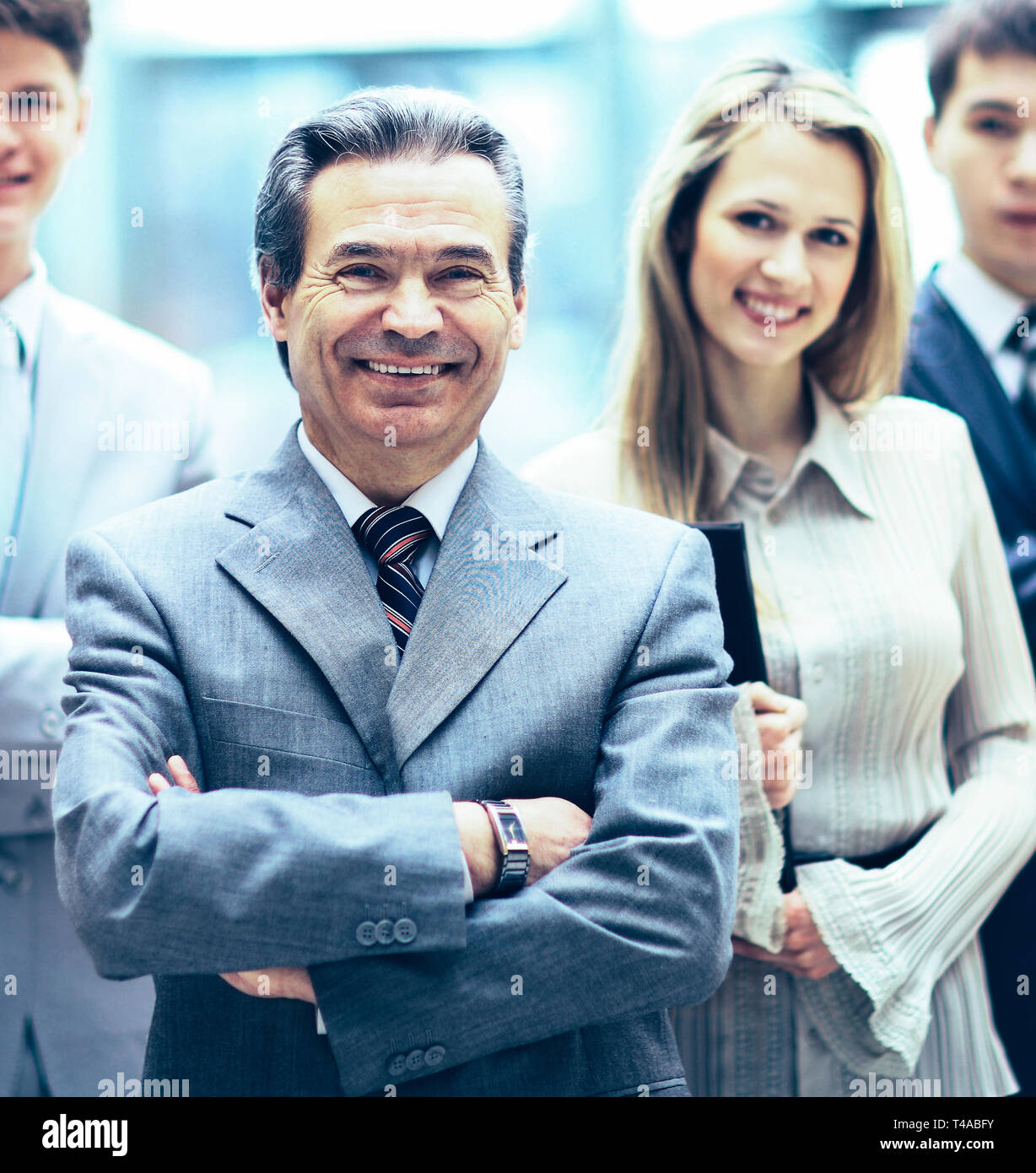 Group portrait of a professional business team looking confidently at ...