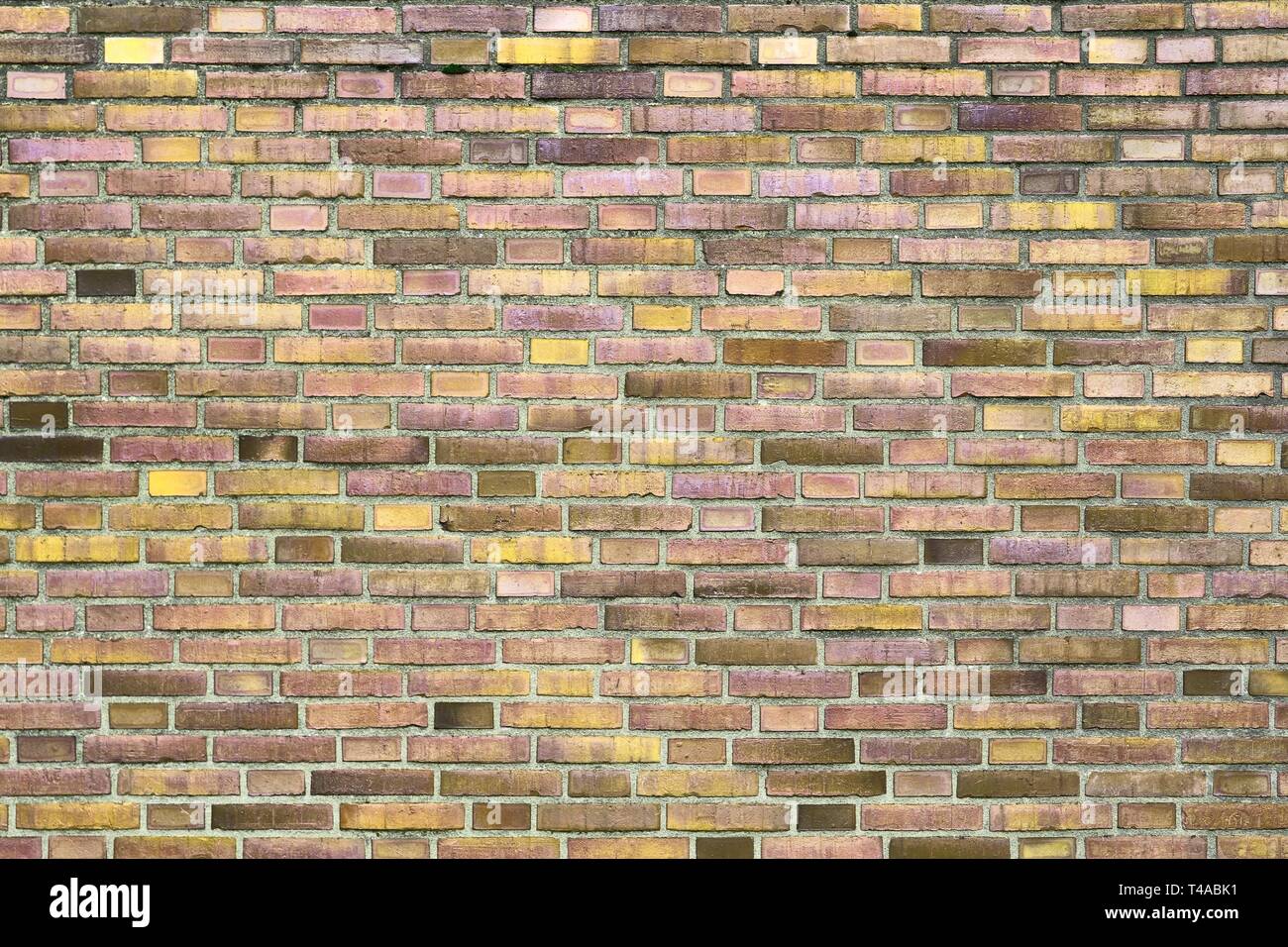 Weathered and aged yellow brick walls with cracks in high resolution ...