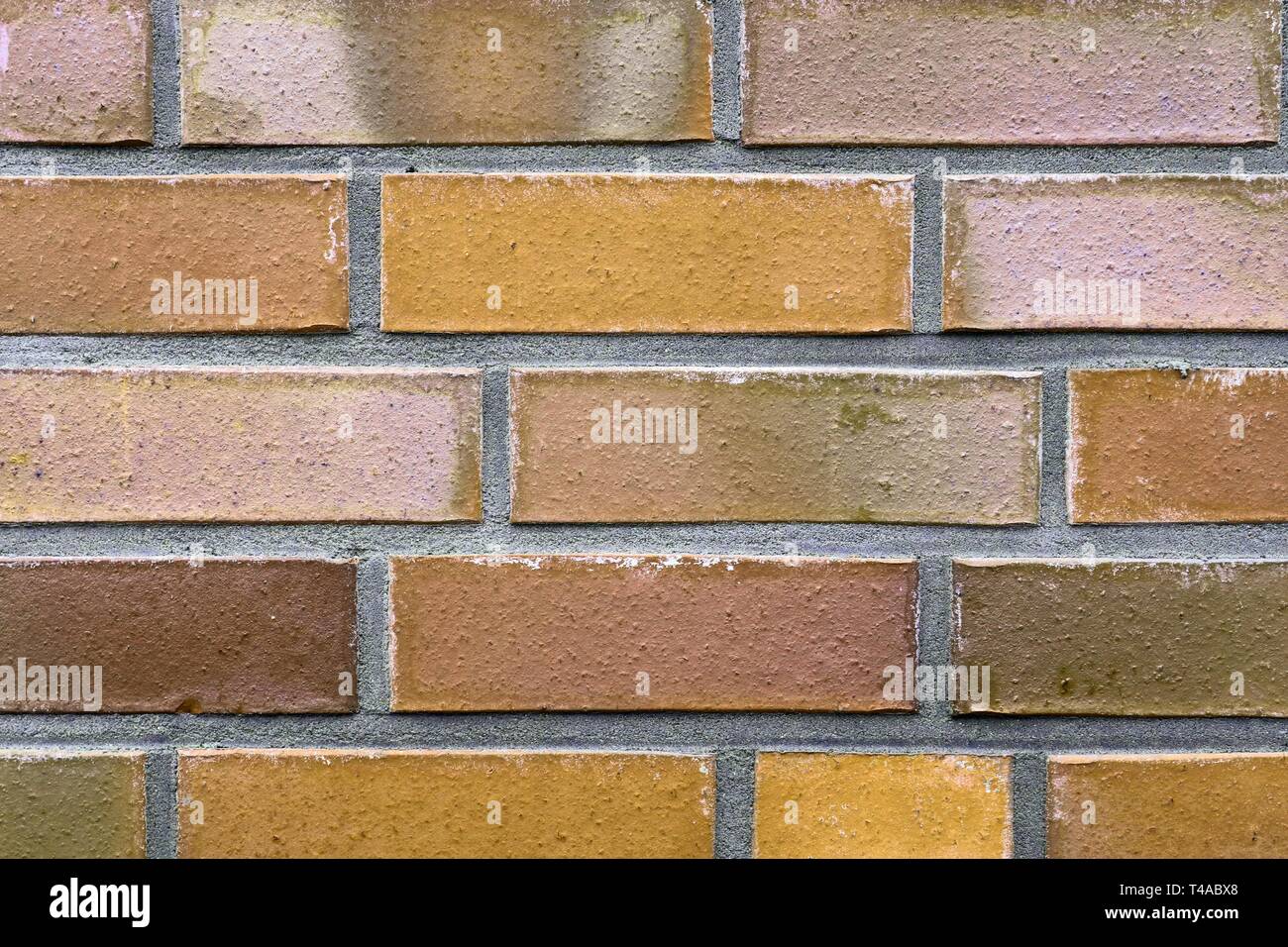 Weathered and aged yellow brick walls with cracks in high resolution ...