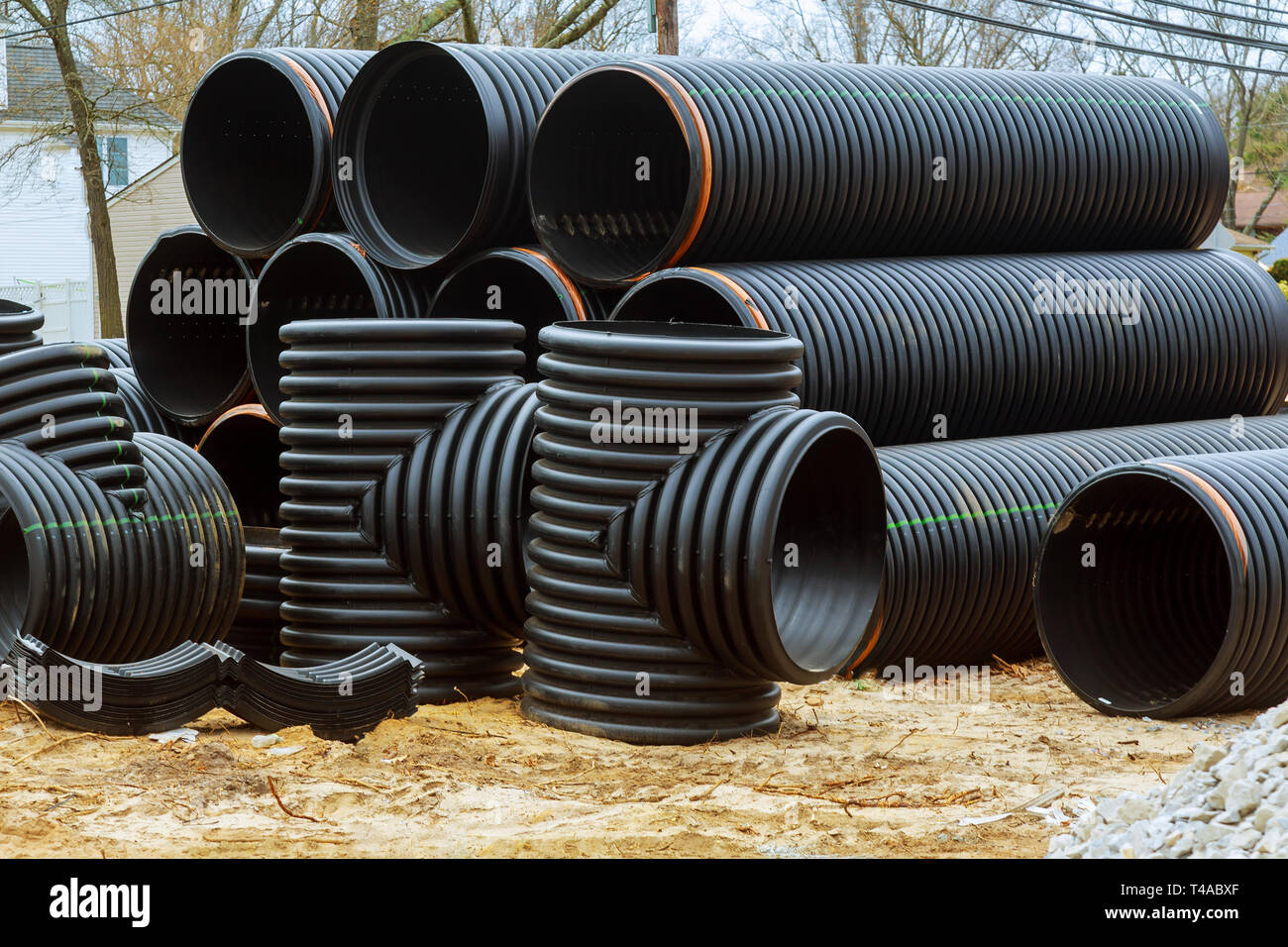 Stacked new PVC pipe for under construction of housing project Stock ...