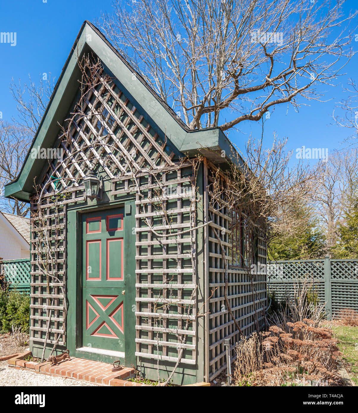 Small garden shed with lattice work Stock Photo - Alamy