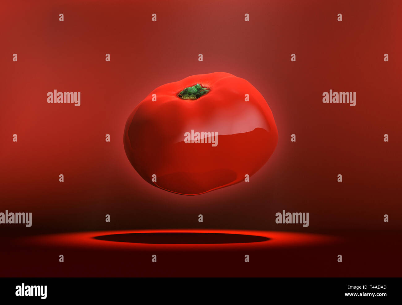 tomato floating on a red back ground Stock Photo - Alamy