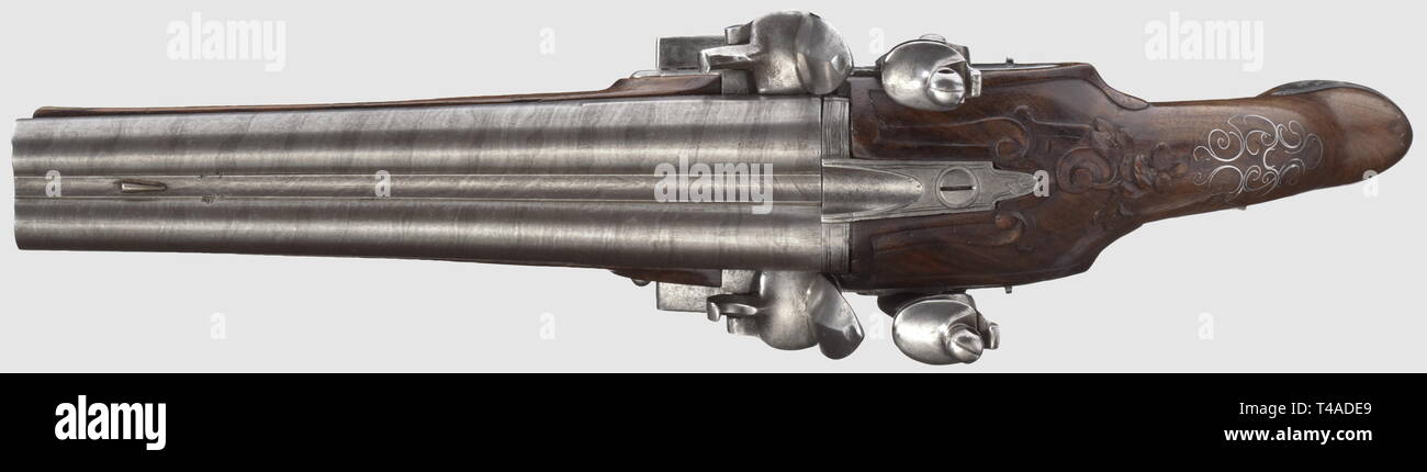 A pair of Belgian double-barrelled flintlock pistols, circa 1810. The ...