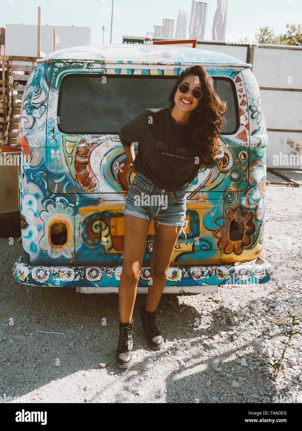 an attractive brunette woman with a vintage caravan Stock Photo - Alamy