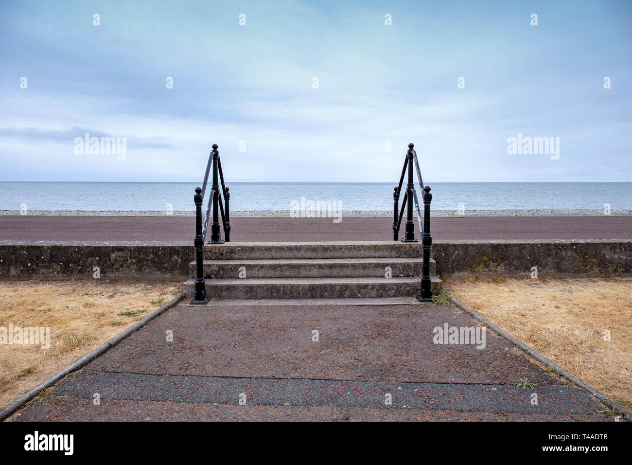 3 Steps with railing for access to promenade over seawall in Llandudno ...