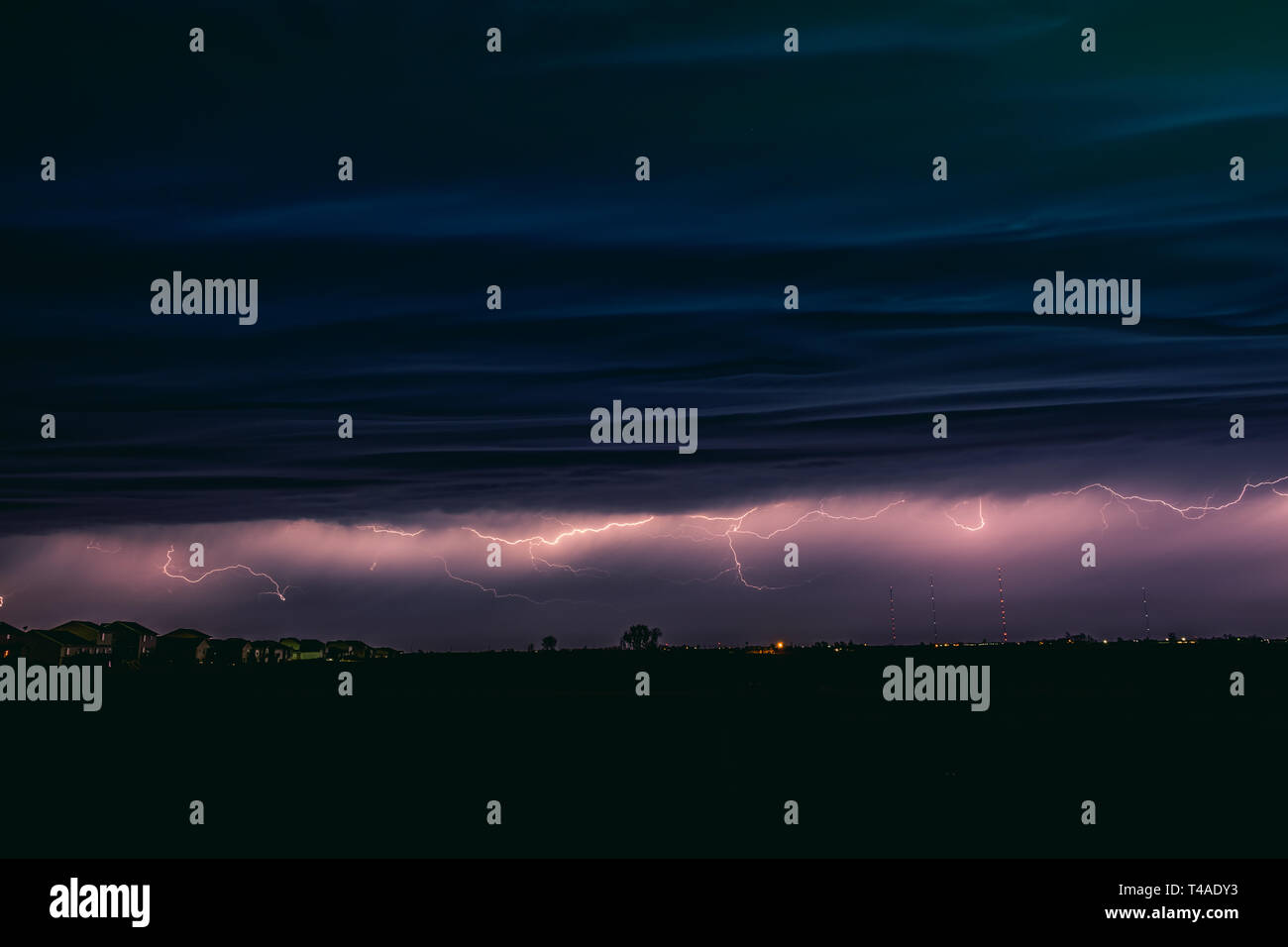 View of lightning strike over a rural farm field, lightning strikes the ...