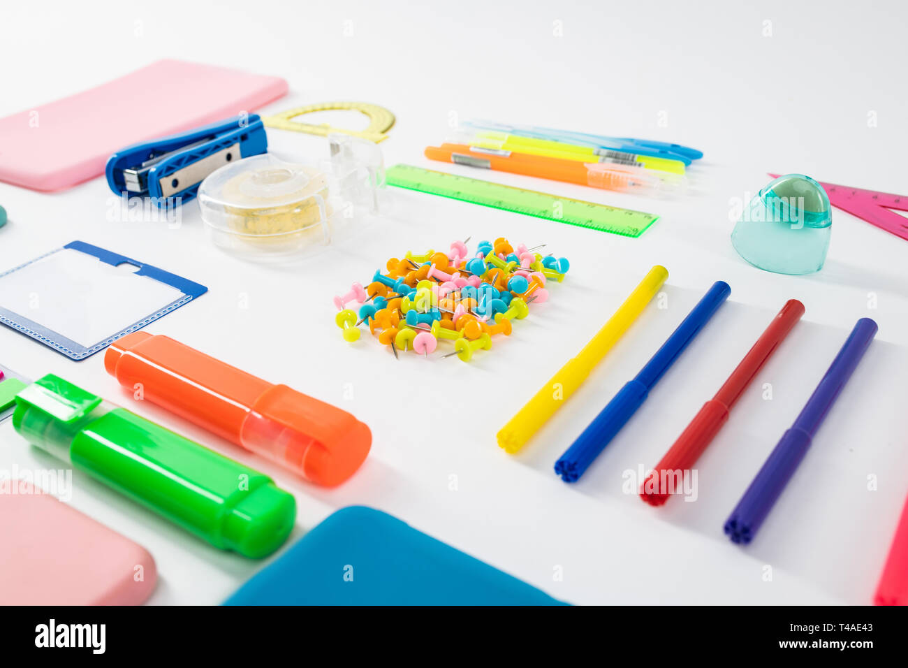 Pencils and tape lying with notes and markers Stock Photo - Alamy
