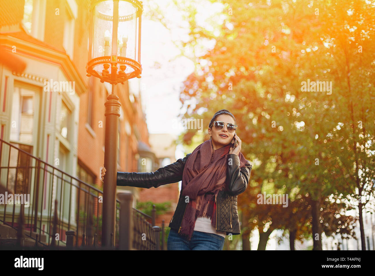 beautiful young girl at his house and uses a telephone Stock Photo - Alamy