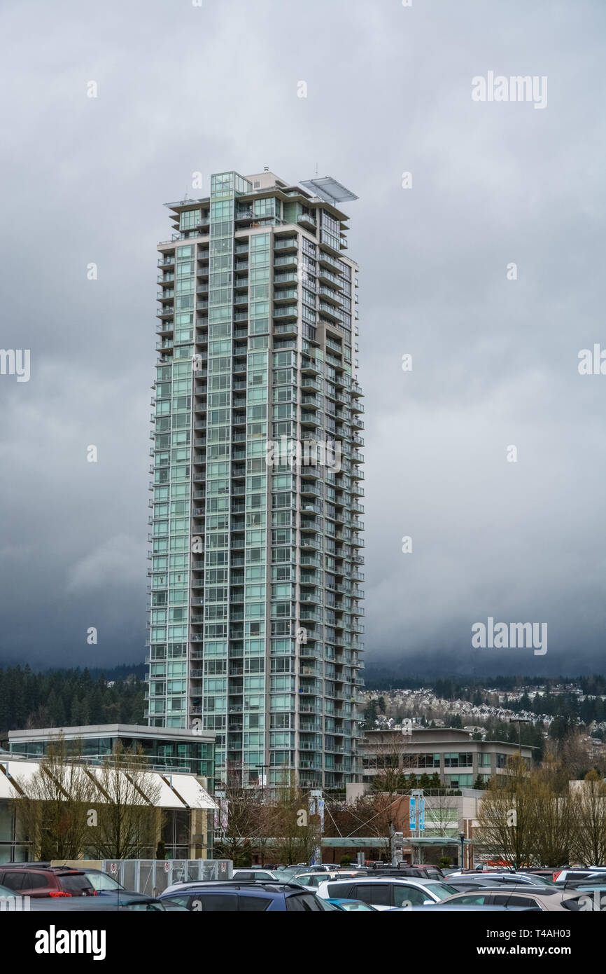 High rise residential building in Vancouver on cloudy sky background ...