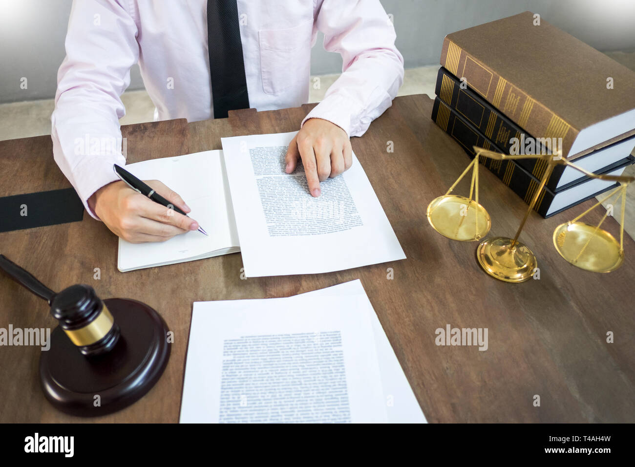 lawyer judge reading documents at desk in courtroom working on wooden ...