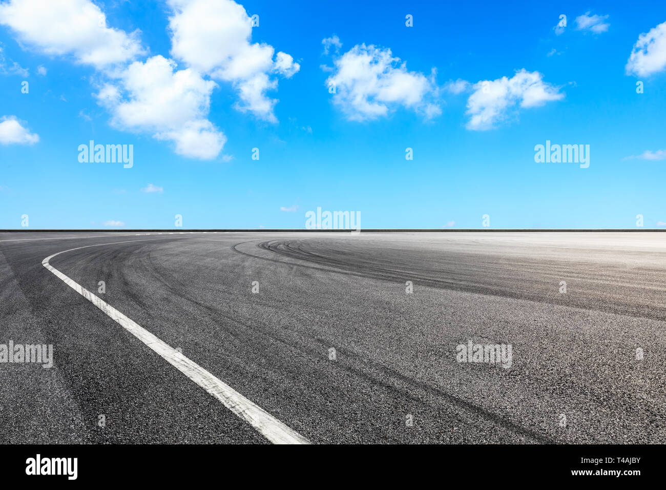 Asphalt race track ground and beautiful sky clouds scene Stock Photo ...