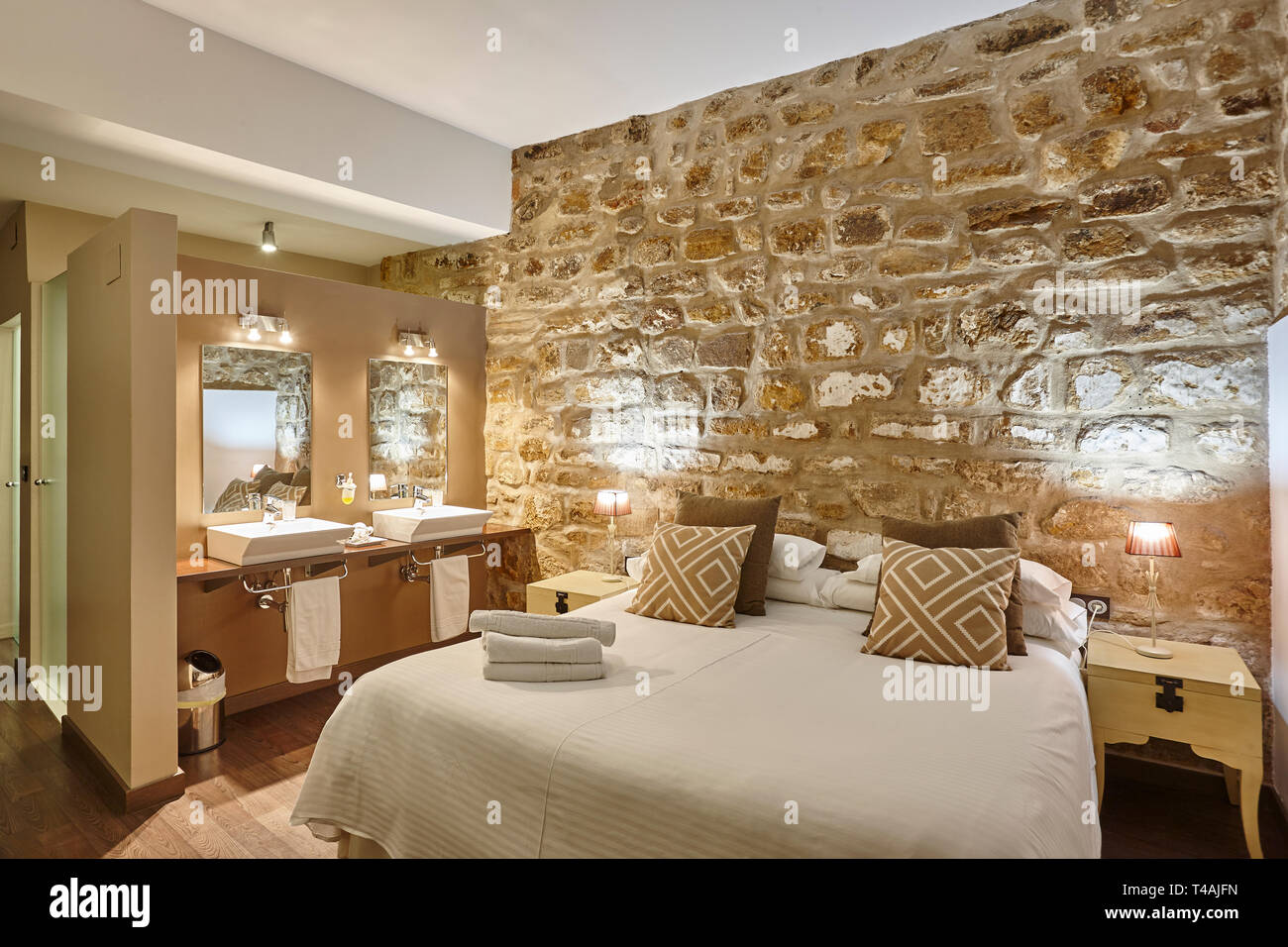 Hotel bedroom interior brick walls hi-res stock photography and images ...