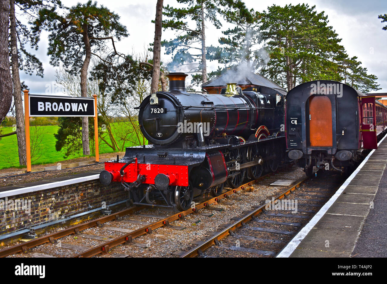 Engine No. 7820 (Dinmore Manor) steams to front of carriages in Broadway station for the trip to ...