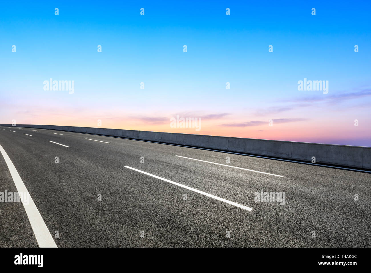 Empty asphalt road and beautiful sky clouds at sunset Stock Photo - Alamy