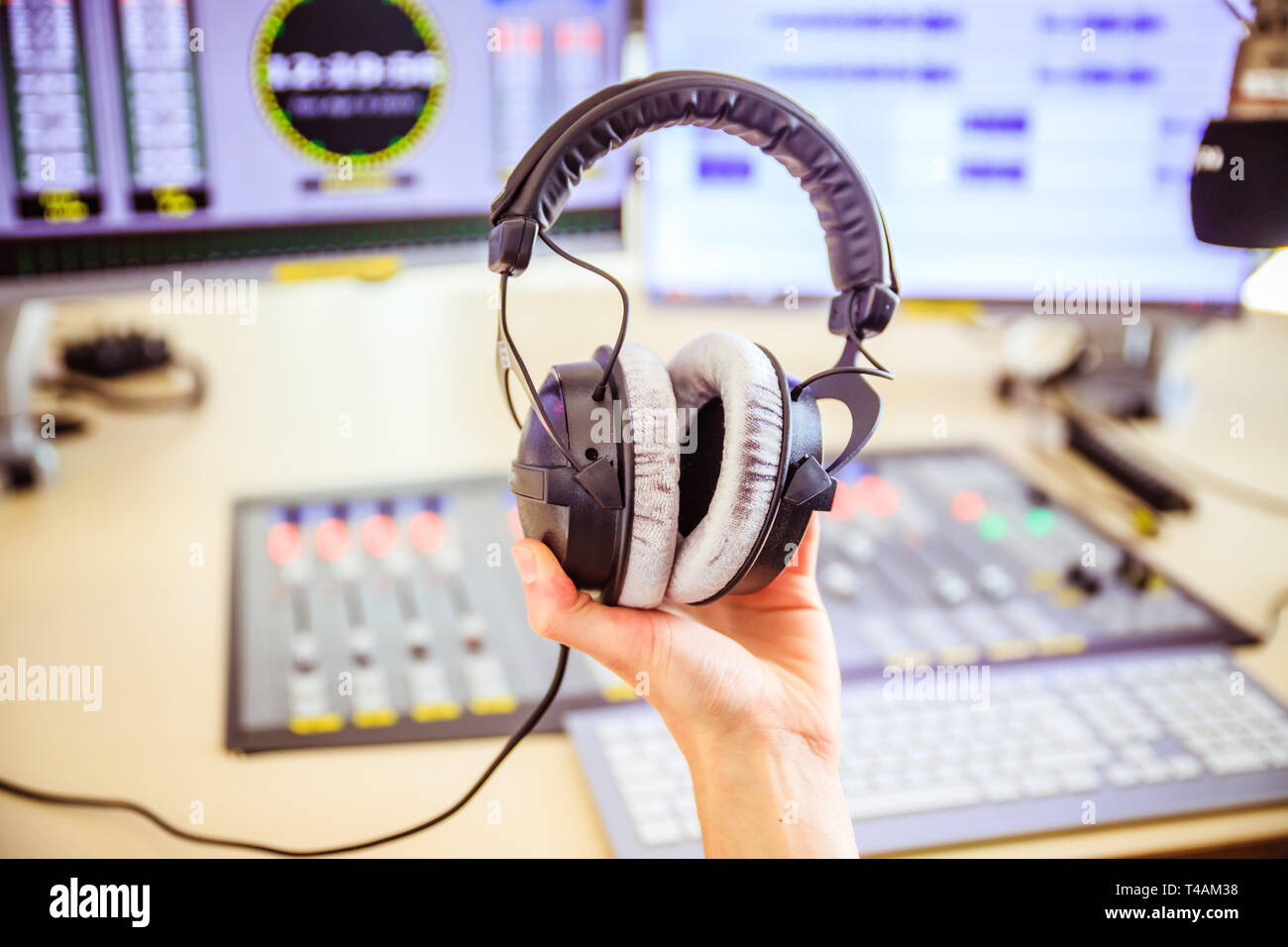 Studio recording: Young is holding headphones in the recording studio ...