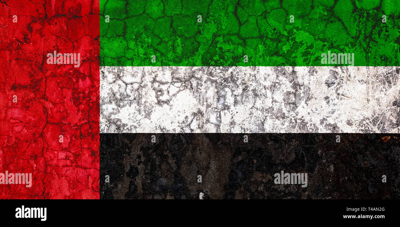 National flag of United Arab Emirates on the background of the old wall ...
