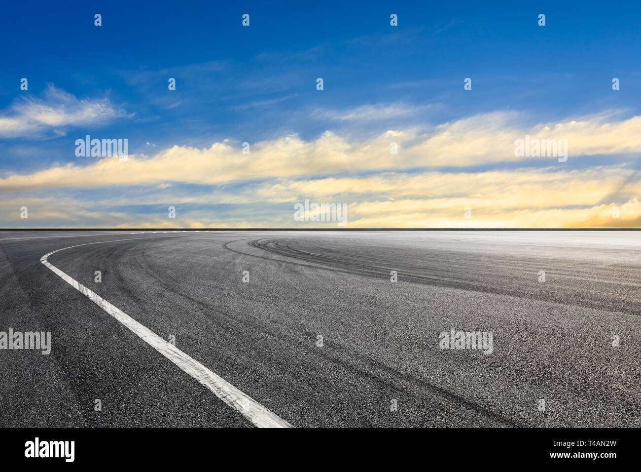 Asphalt race track ground and beautiful sky clouds at sunset Stock ...