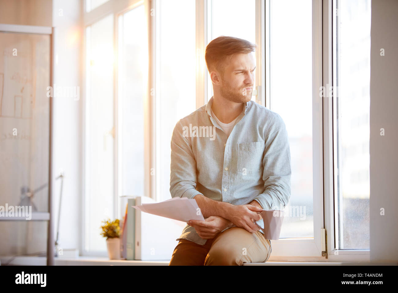 Sitting at window hi-res stock photography and images - Alamy