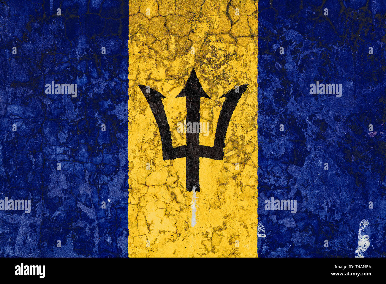 National flag of Barbados on the background of the old wall covered ...