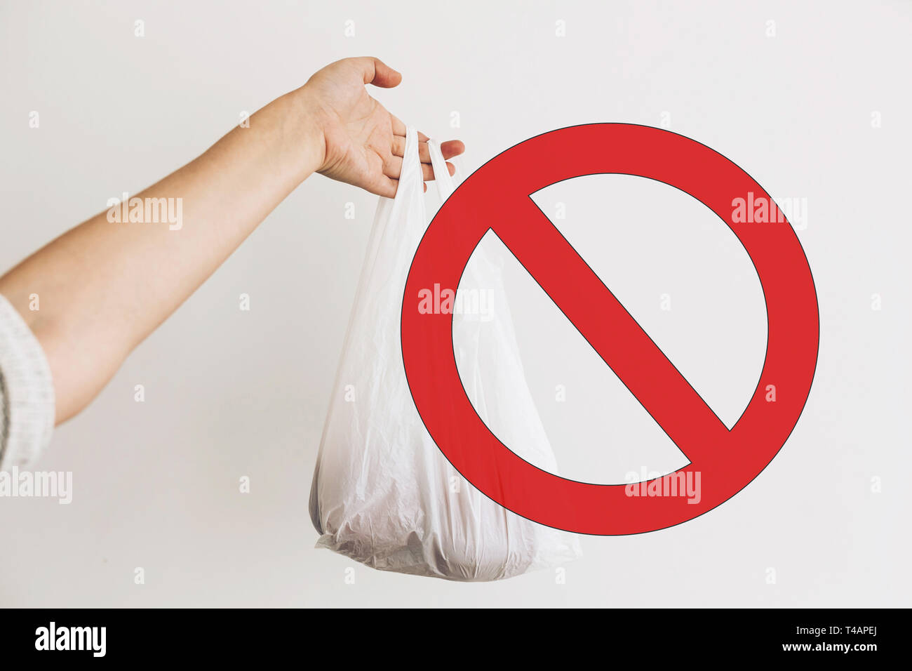 Ban single use plastic, stop sign. Woman holding in hand groceries in ...