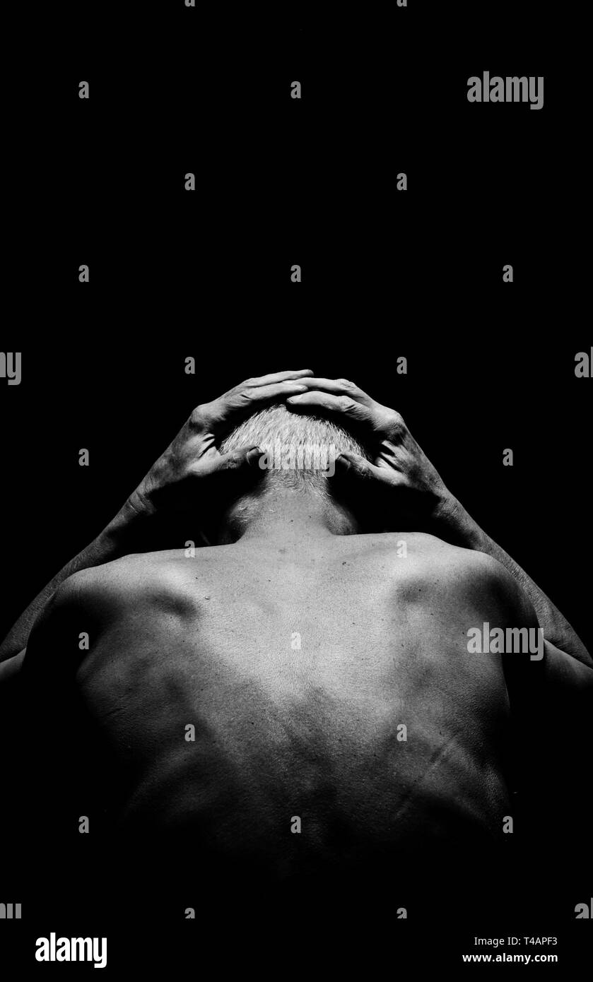 Man in despair clutched his head in black and white Stock Photo - Alamy