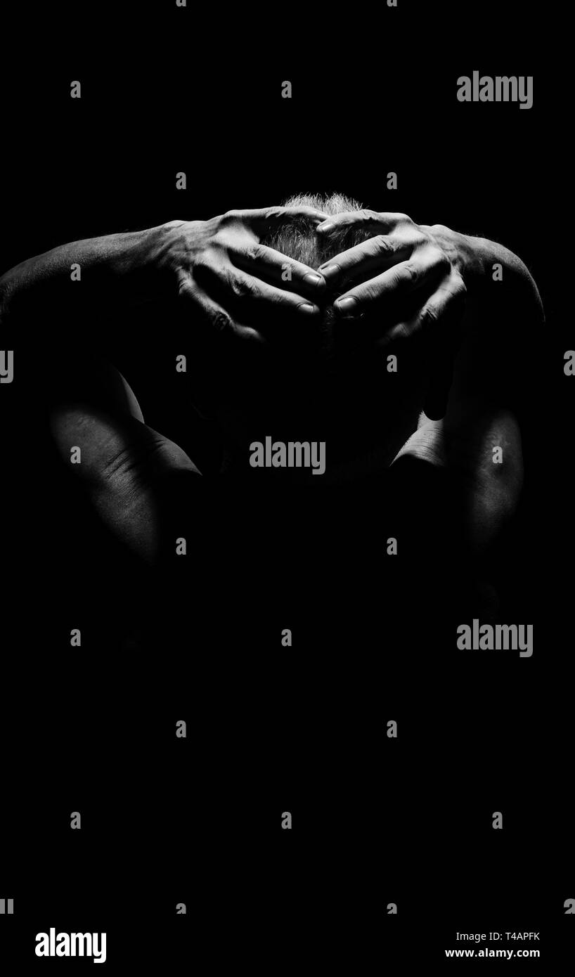 Man in despair clutched his head in black and white Stock Photo - Alamy