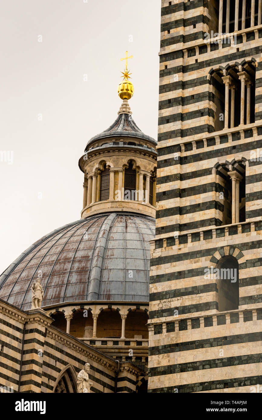 Romanesque Siena Cathedral and black and white striped dome and bell ...