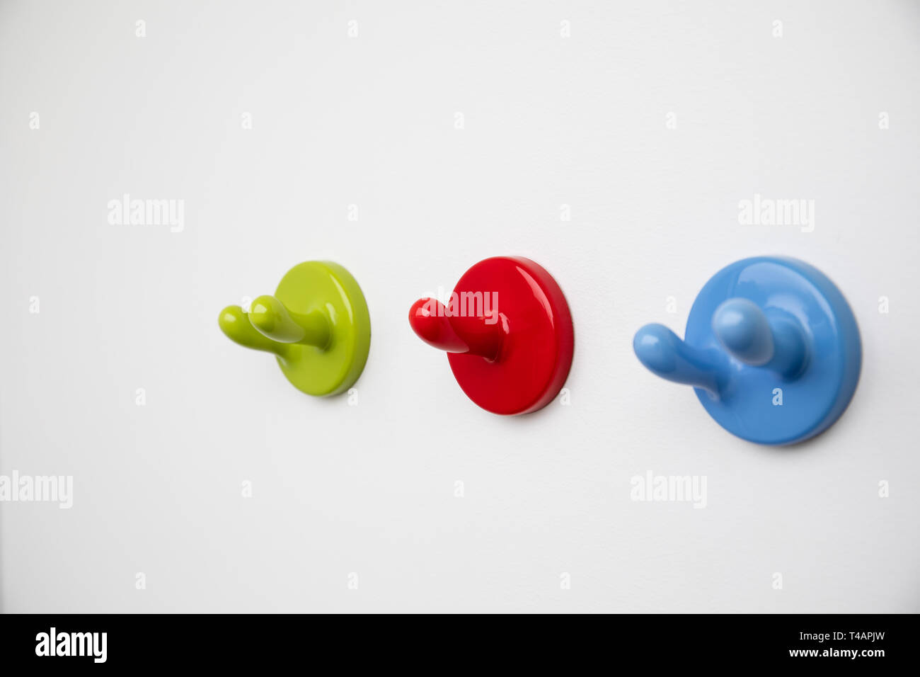 Colorful clothes hooks Stock Photo - Alamy