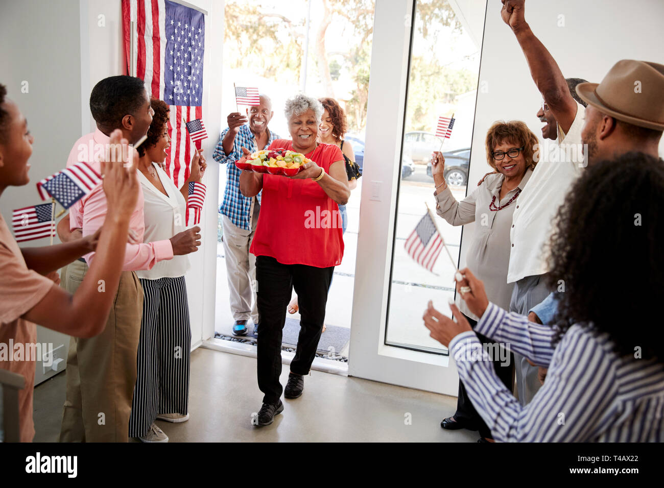 Black family arriving for an Independence Day house party with their ...