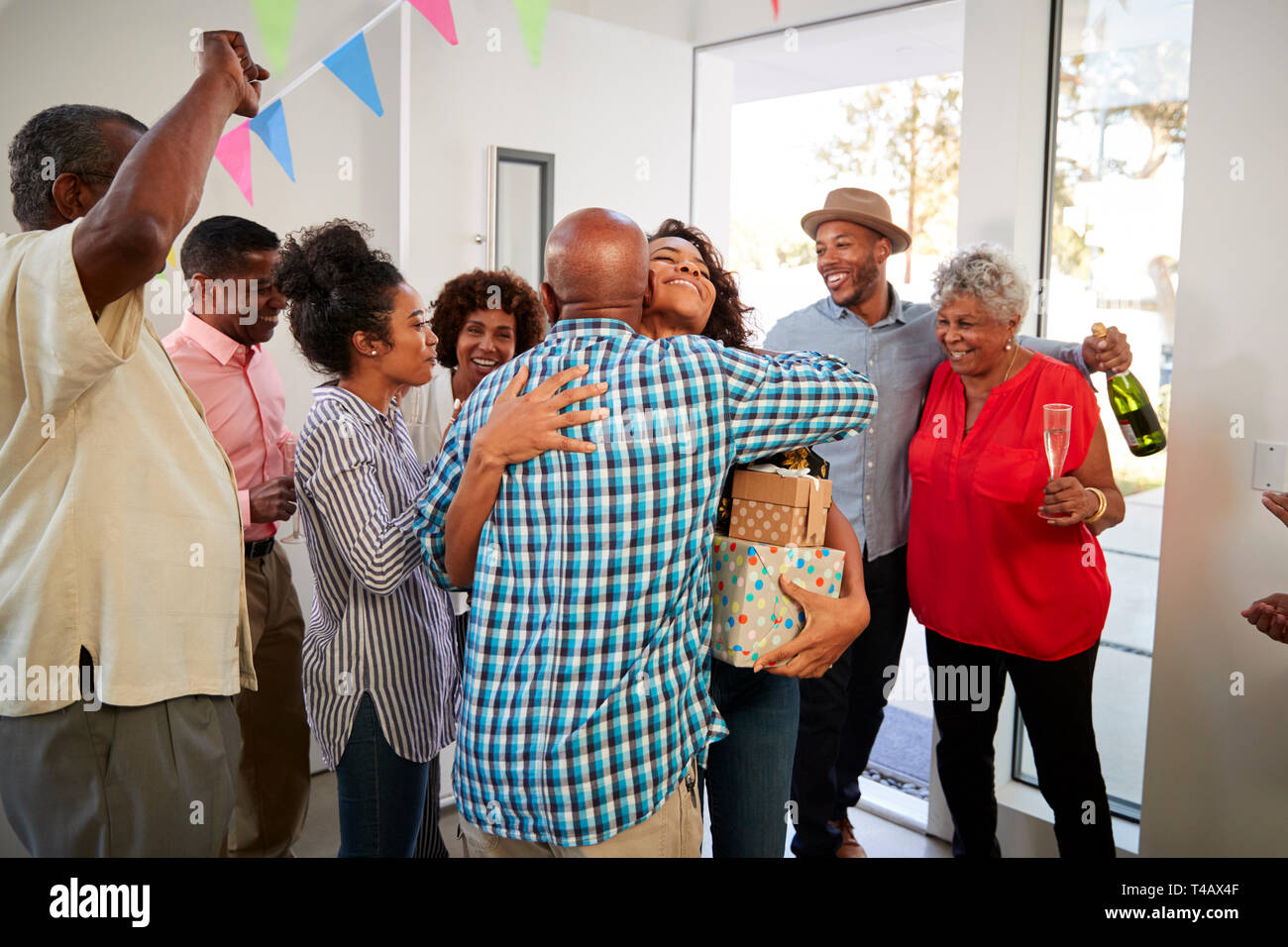 Welcoming guests into home hi-res stock photography and images - Alamy