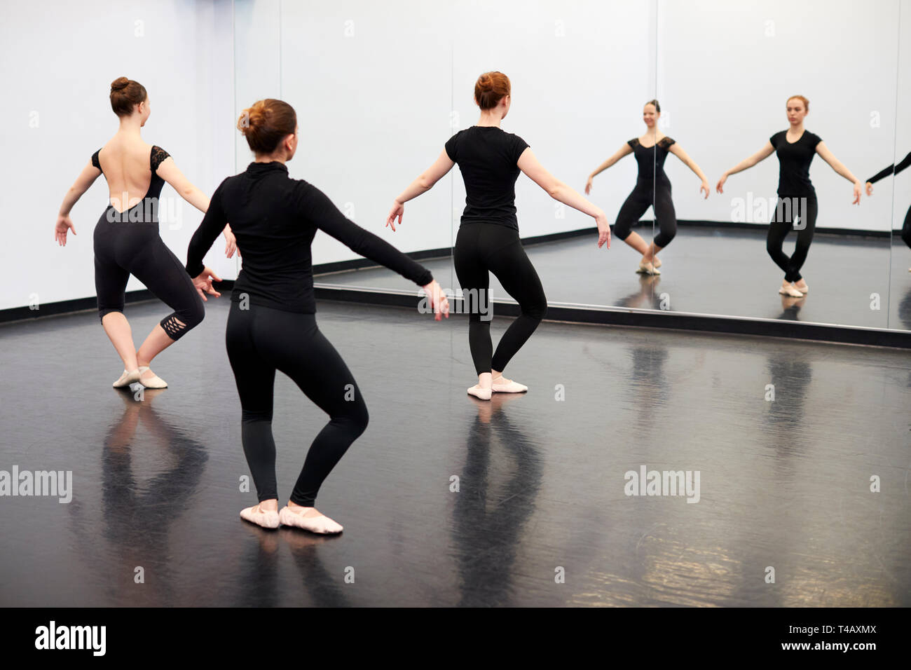 Female Students At Performing Arts School Rehearsing Ballet In Dance ...