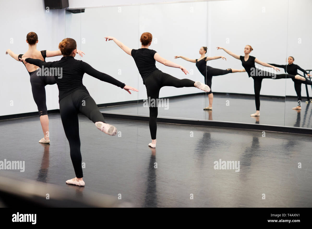 Female Students At Performing Arts School Rehearsing Ballet In Dance ...