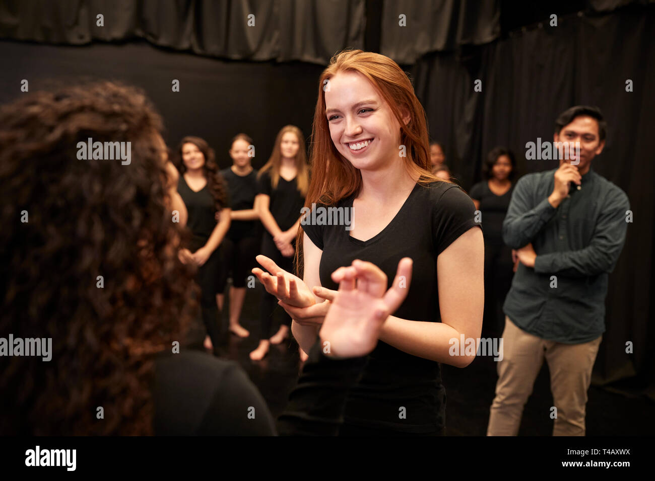 Teacher With Male And Female Drama Students At Performing Arts School ...