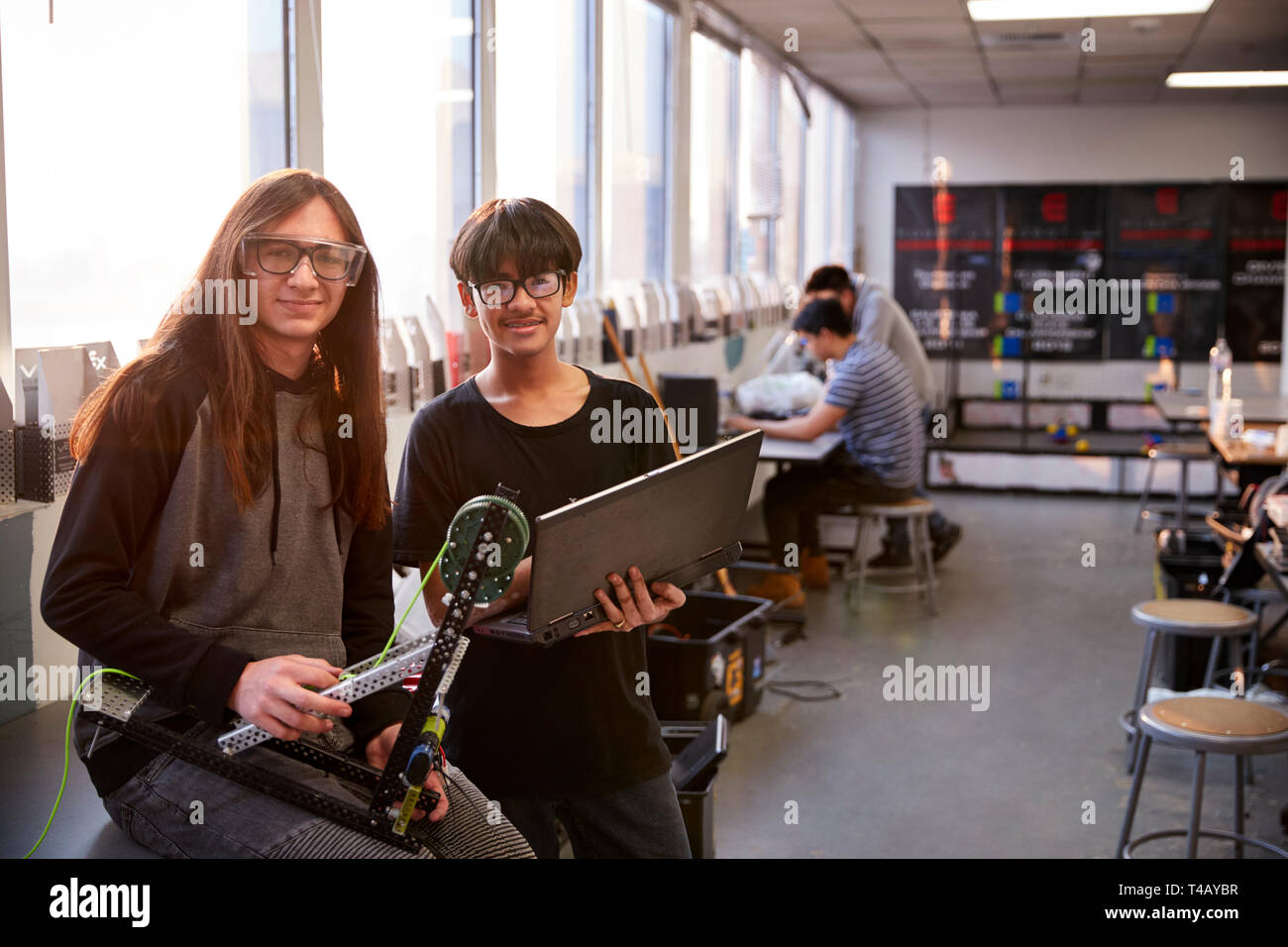 Portrait Of Male College Students With Computer Controlled Rig In ...