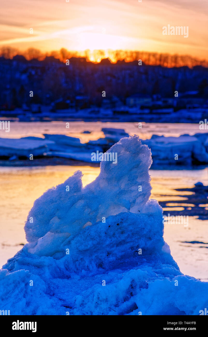 Backlit ice glowing in the sunset on the St Lawrence river at Cap Rouge ...