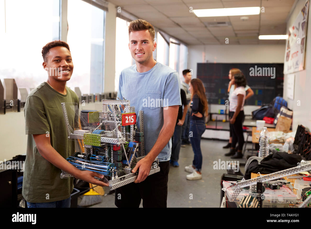 Two students standing together in class hi-res stock photography and ...