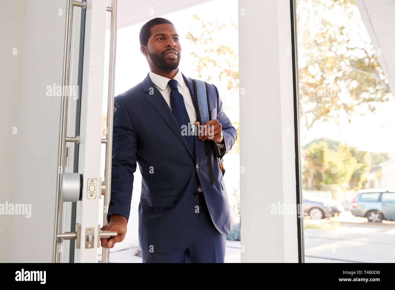 Businessman Wearing Suit Opening Door Returning Home From Work Stock ...