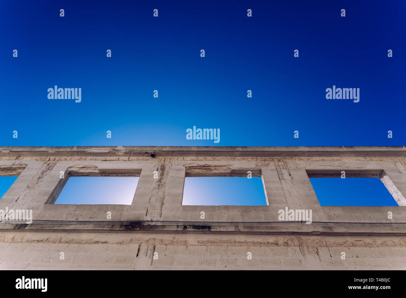 Window of abandoned building without finishing its construction ...