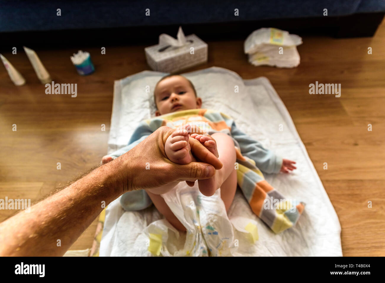 Changing babys diaper hi-res stock photography and images - Alamy