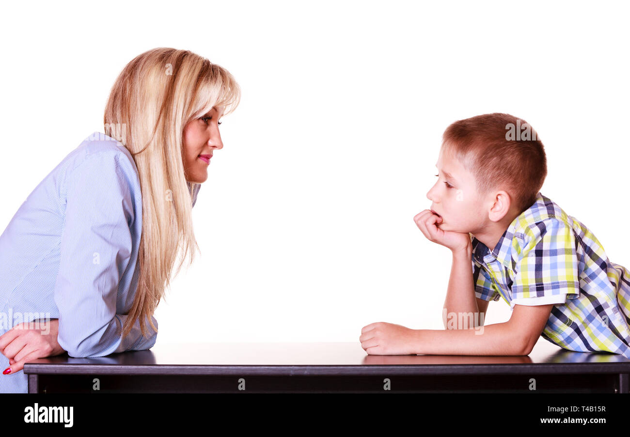 Relationships arguments and discussion. Mother and son sit at table and ...