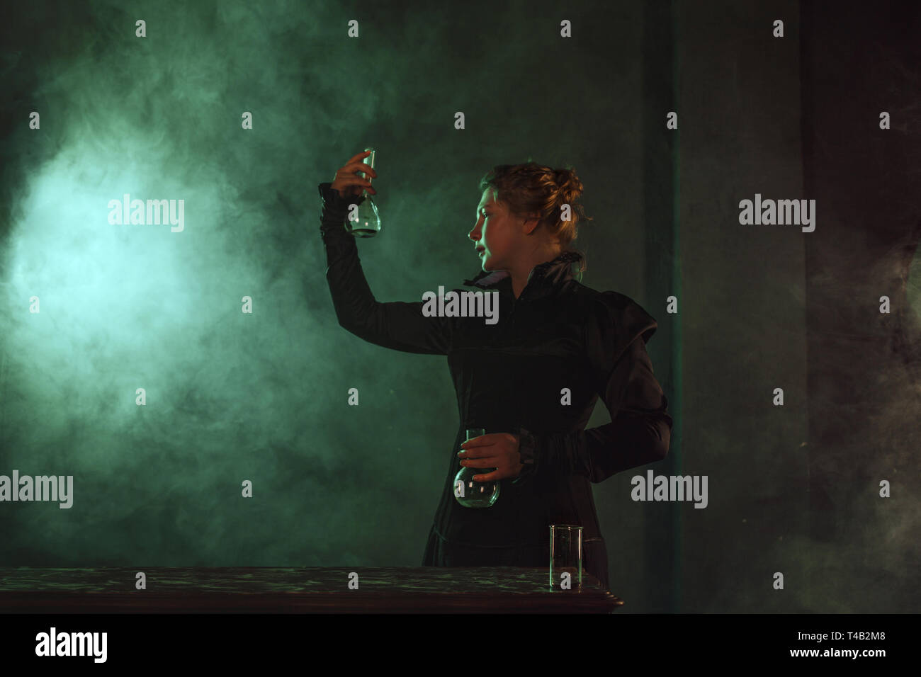 Scientist researcher with a flask of radioactive material. History of ...