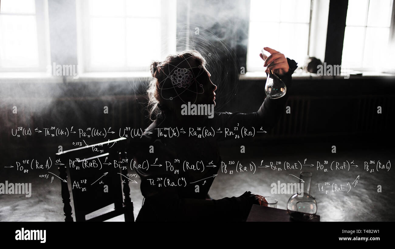 Scientist researcher with a flask of radioactive material. The study of ...