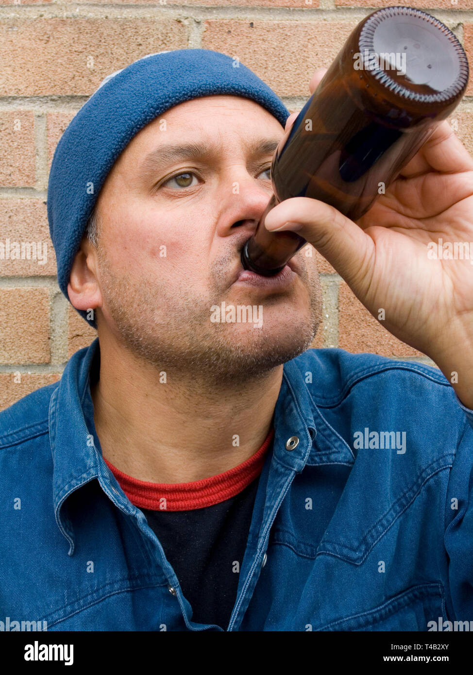 Old alcoholic male drinking hi-res stock photography and images - Alamy