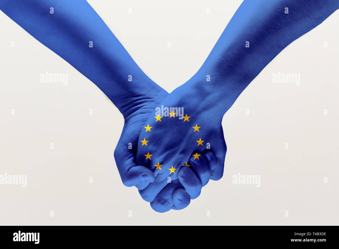 Peace and strong. Male hands holding colored in blue EU flag isolated ...