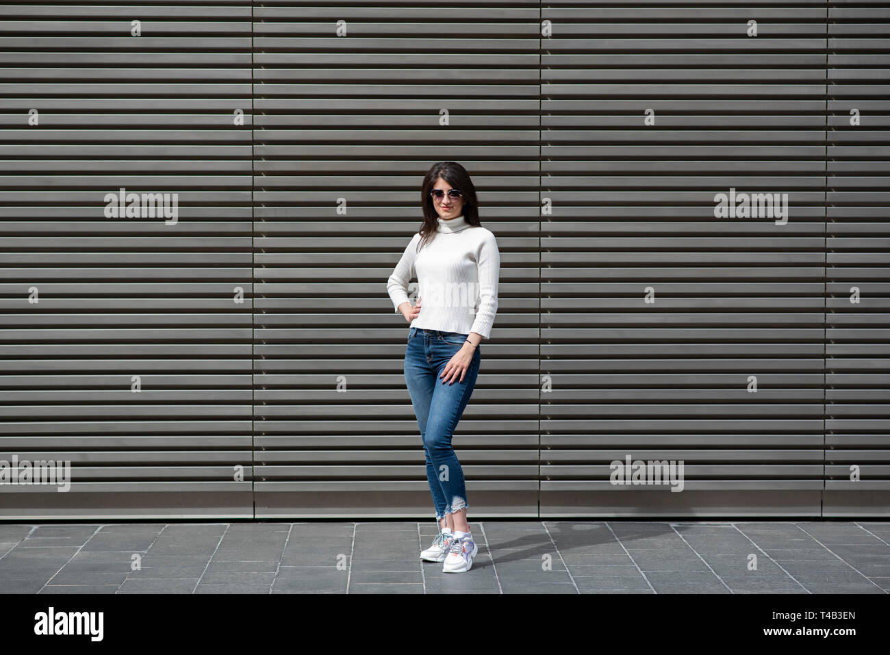 Beautiful woman standing outdoors Stock Photo - Alamy